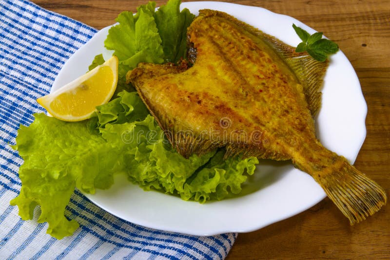 Fried Fish Flounder on White Plate with Lettuce and Lemon Stock Image ...
