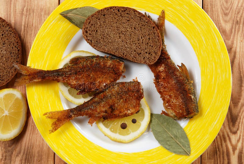 Fried fish with lemon stock image. Image of wood, freshwater - 68727947