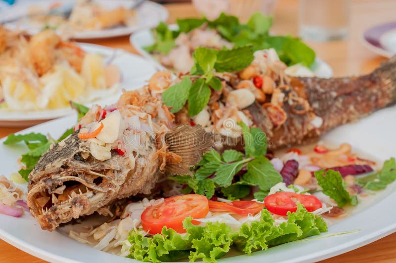 Fried fish with mixed herb stock image. Image of filet - 40092139