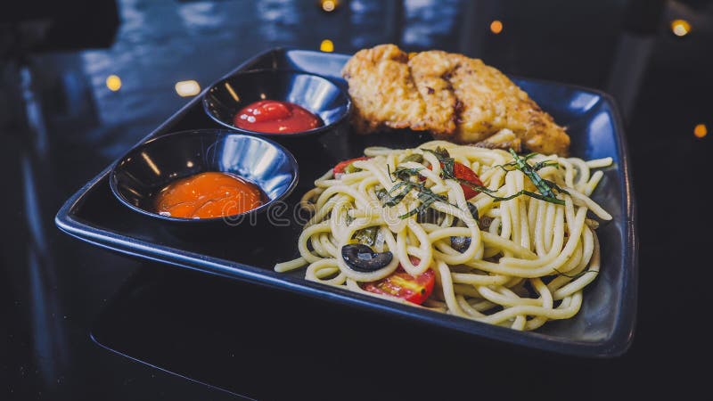 Spaghetti with Fried Fish stock image. Image of delicious - 122773747