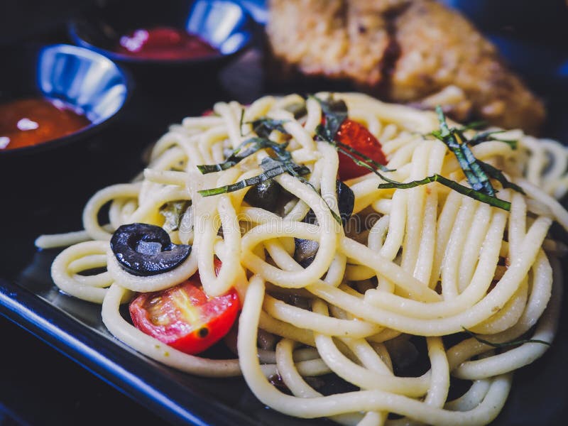 Spaghetti with Fried Fish stock photo. Image of delicious - 122773748