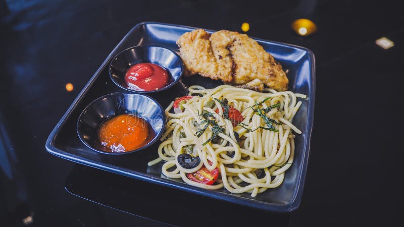 Spaghetti with Fried Fish stock photo. Image of delicious - 122773748