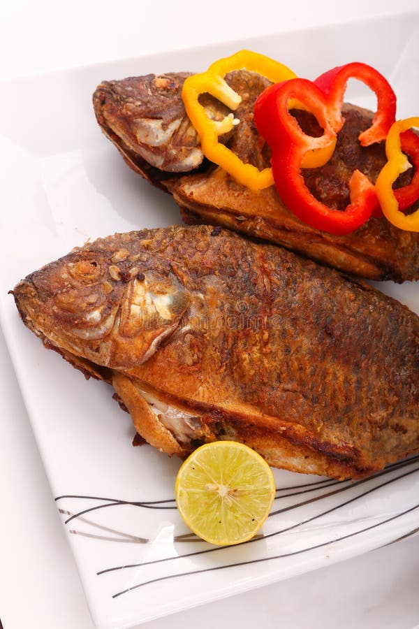 Fried fish plate stock image. Image of fresh, green - 106557781
