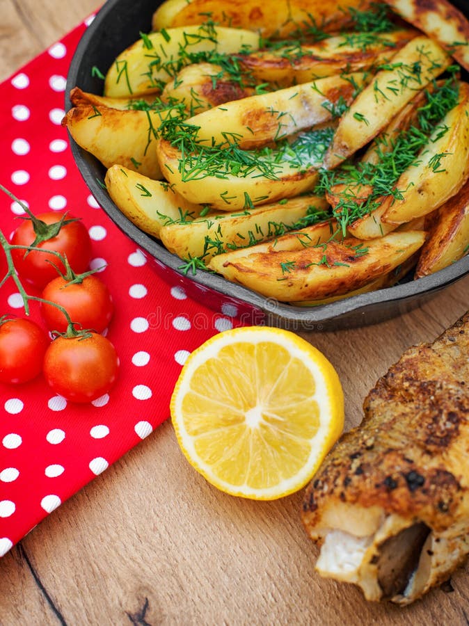 Fried fish and potatoes. stock image. Image of dining - 54887353