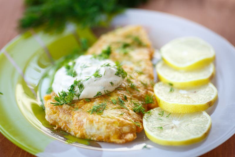Grilled Fish with Fried Potatoes and Salad Top View, Closeup Stock ...