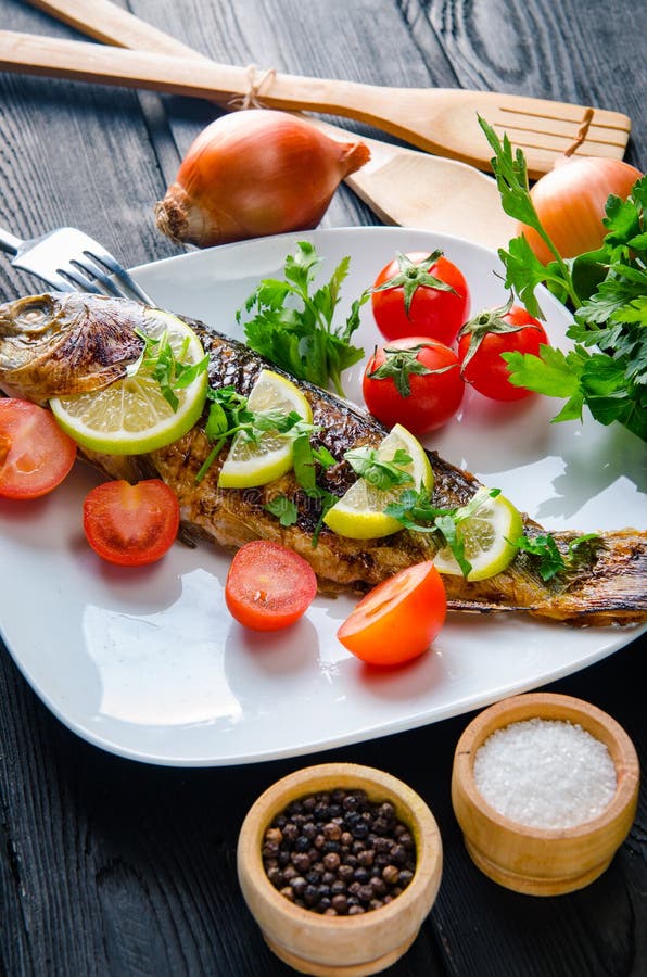 The Fried Fish Served on the Plate Stock Image - Image of herbs, fried ...