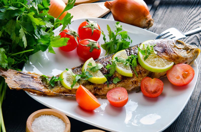 Fried Fish Served on the Plate Stock Image - Image of fresh, herbs ...