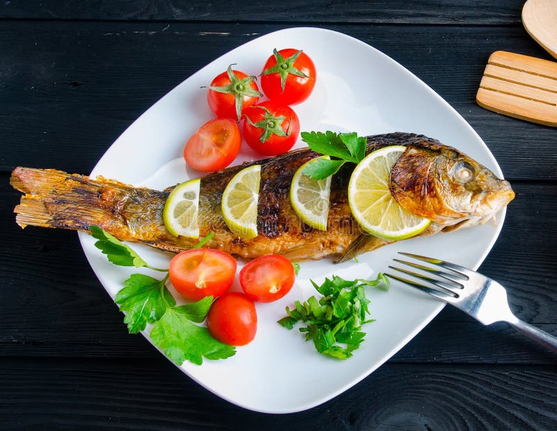 Fried Fish Served on the Plate Stock Image - Image of cooked, knife ...