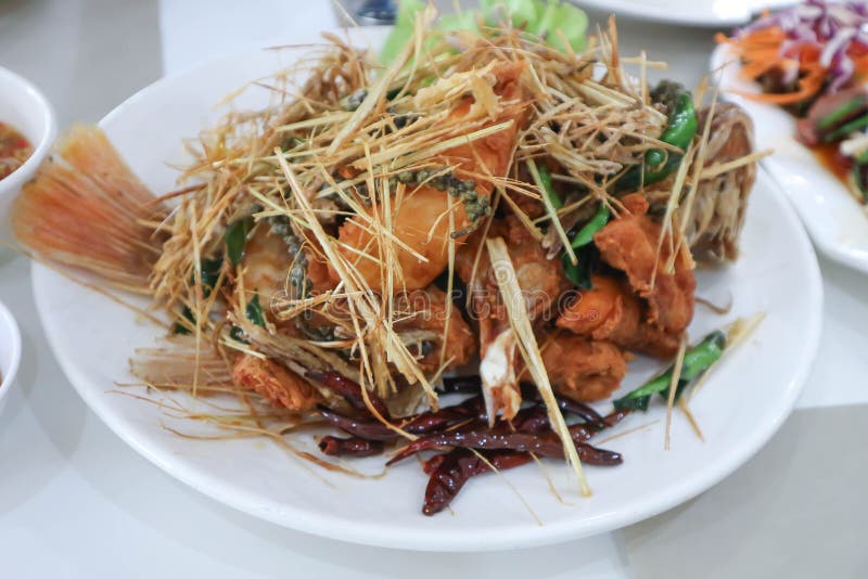 Fried Fish or Fried Sliced Fish or Fried Ruby Fish with Vegetable Stock ...
