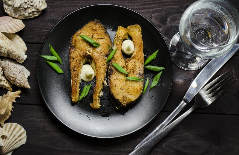 Fried fish steaks stock image. Image of sauce, vegetable - 112424175