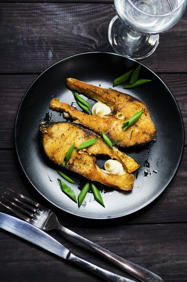 Fried fish steaks stock image. Image of french, green - 113597561