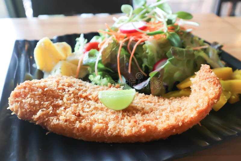 Fried Fish with Tomato Gravy and Salad or Fish and Chips Stock Photo ...