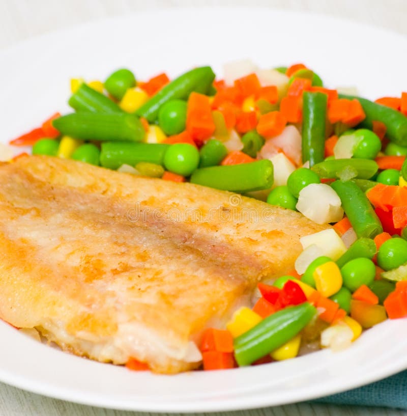 Fried fish with vegetables stock image. Image of gourmet - 29005135