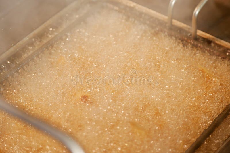 Fried food in hot oil stock photo. Image of process - 353635868