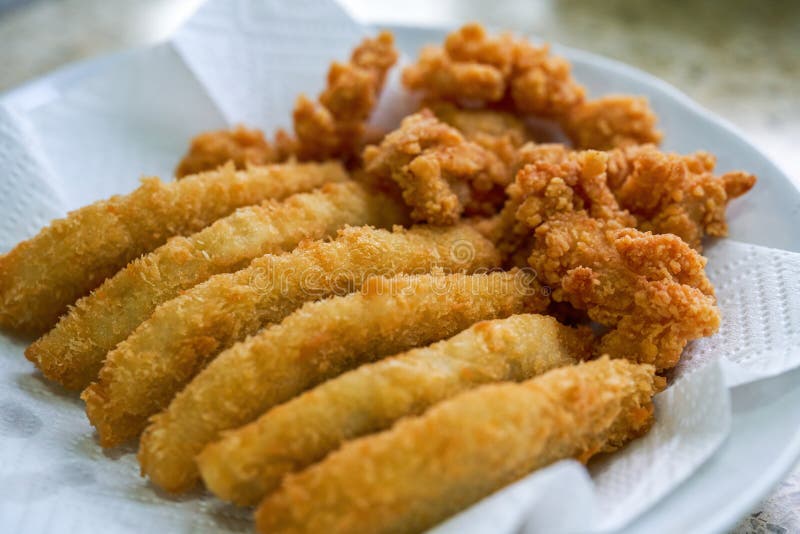 A Fried Food Platter of Crispy Cod Sticks and Chicken Nuggets Stock ...