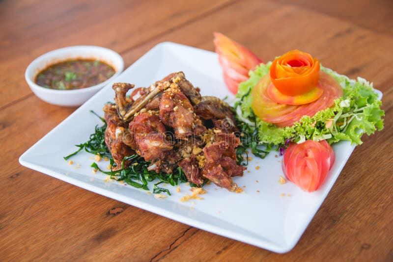 Fried Frog with Garlic stock image. Image of lemon, parsley - 83358531