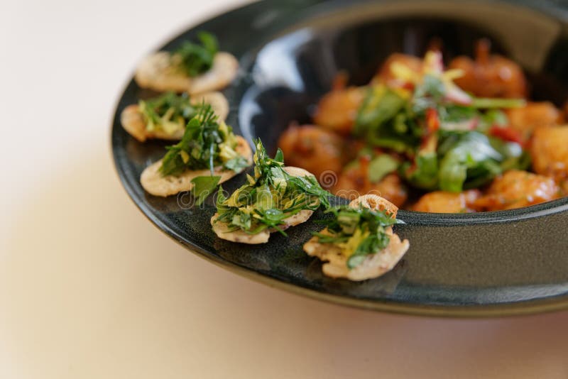 Fried Frog Legs in Black Plate Stock Image - Image of food, cuisine ...