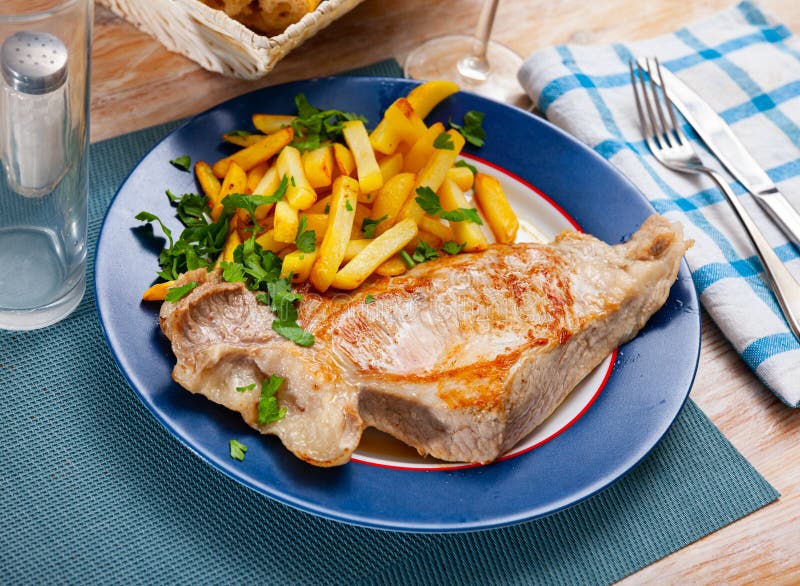 Fried Iberian Pig Served with Potatoes Stock Photo - Image of secreto ...