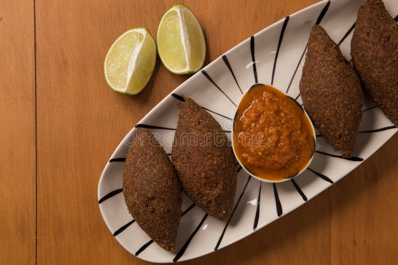 Fried Kibbeh Served with Pepper Sauce, on a White Plate Stock Photo ...