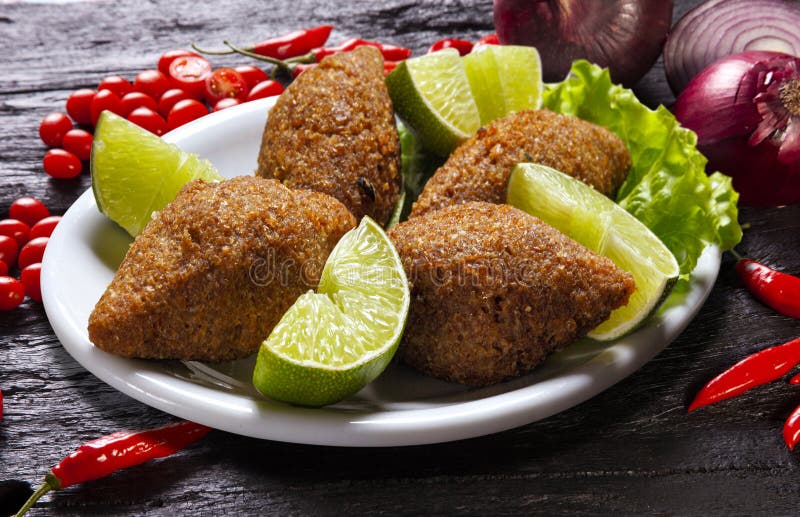 Fried kibble with lemon stock image. Image of kibbeh - 392889745