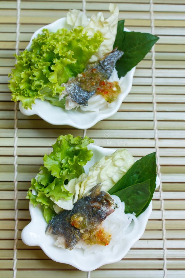 Fried Mackerel Served with Boiled Thai Rice Vermicelli. Stock Photo ...