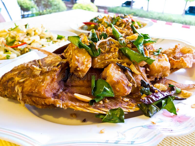 Fried Mango Fish, Topped with Herbs and Nut Stock Image - Image of ...