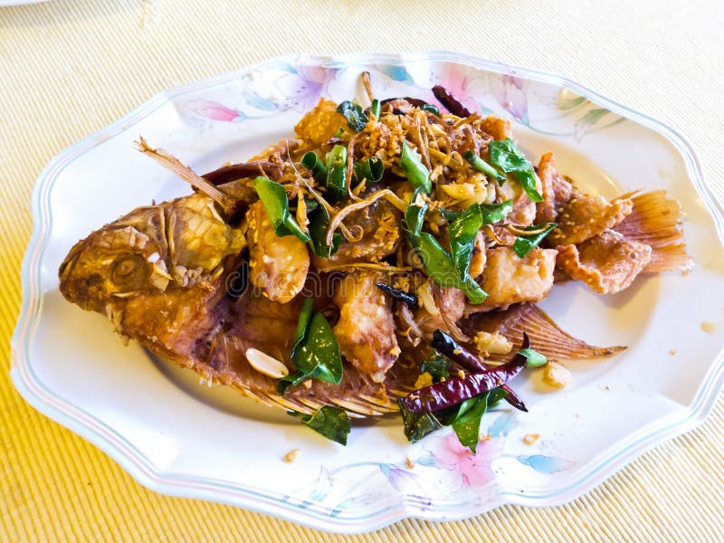 Fried Mango Fish, Topped with Herbs and Nut Stock Photo - Image of ...