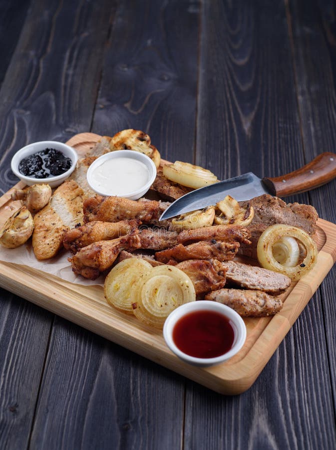 Fried meat on the board stock photo. Image of marble - 183848718