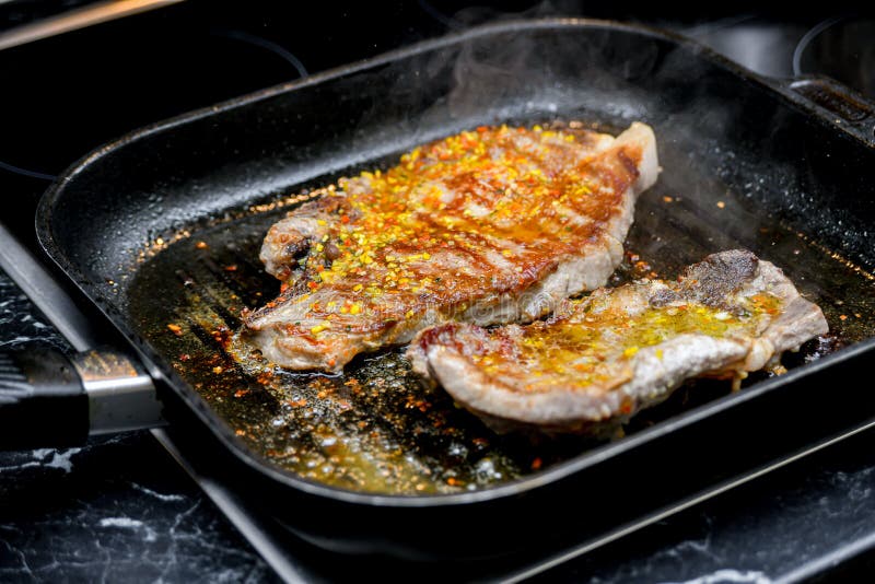Fried Meat in a Pan with Spices, Cut into Pieces Stock Photo - Image of ...