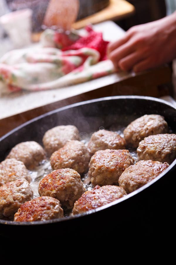 Fried Meat Patties are Cooked in a Pan in the Oil in the Kitchen Stock ...