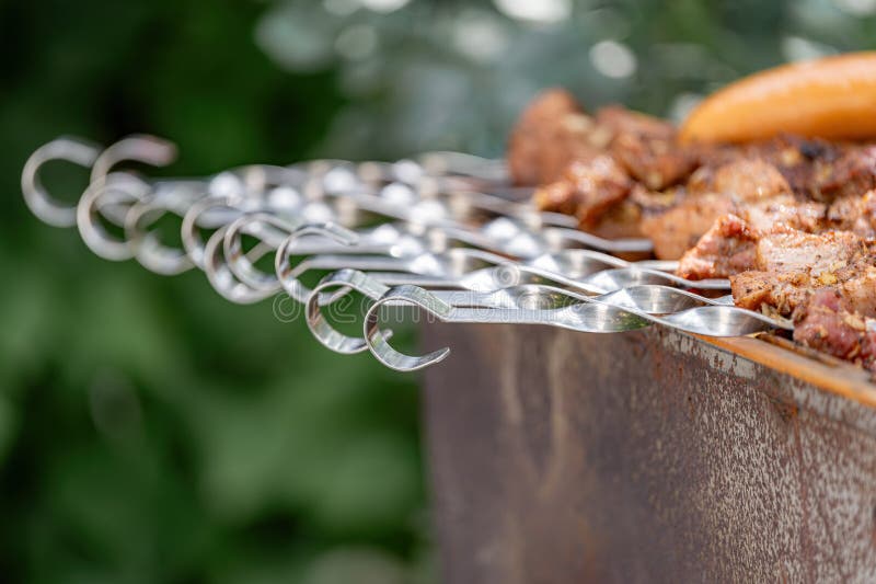 Fried Meat Strung on Skewers is Fried Over an Open Fire on a Grill ...
