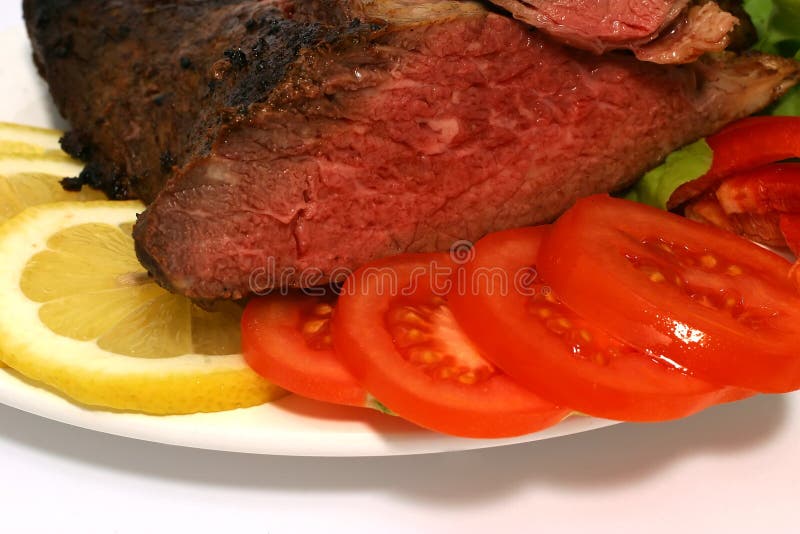 Fried meat and vegetables stock image. Image of roast - 4475545