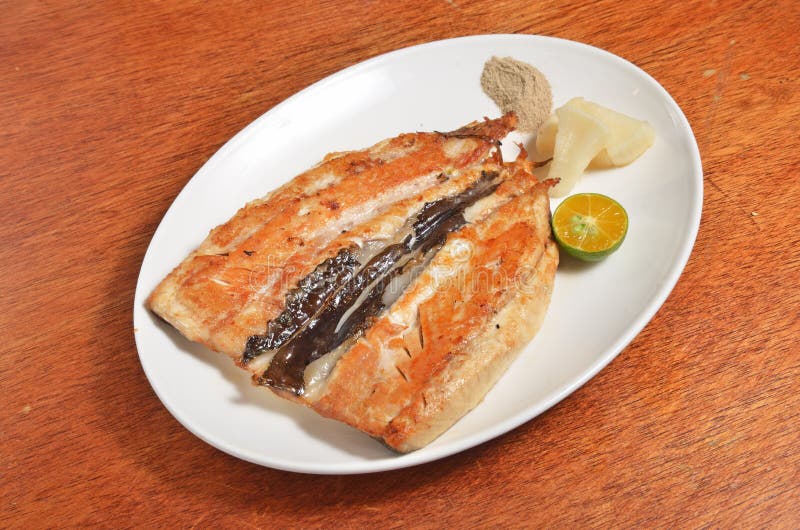Fried Milkfish on a Plate on Wooden Table Stock Image - Image of fresh ...