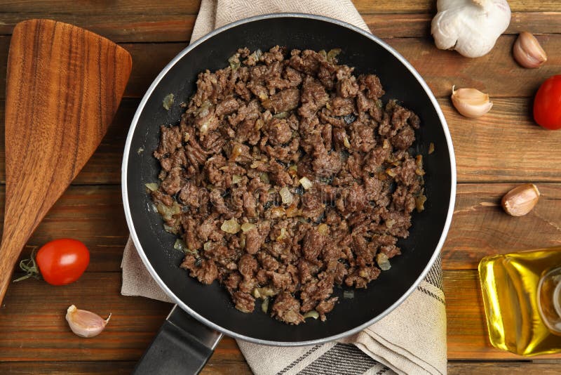 Fried Minced Meat with Onion Served on Wooden Table, Flat Lay Stock ...