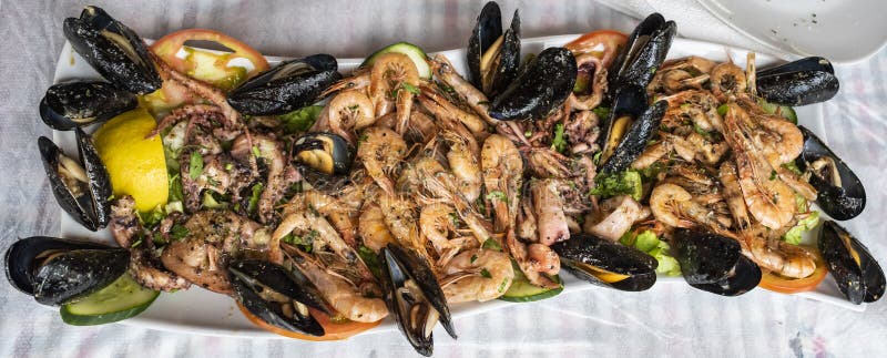 Fried mixed seafood dish stock photo. Image of closeup - 155533122