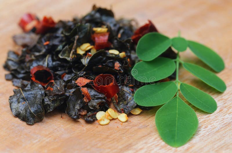 Fried and moringa leaves stock image. Image of mlonge - 51783261
