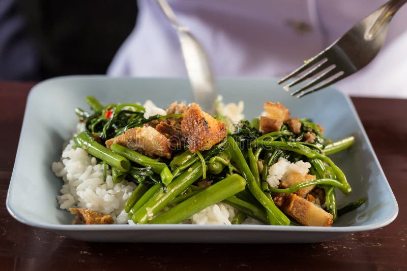 Thai Food Fried Morning Glory With Crispy Pork And Rice. Stock Photo ...
