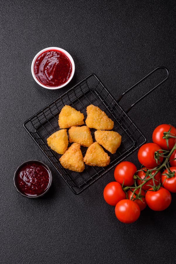 Fried Mozzarella or Brie Cheese with Cranberry or Raspberry Sauce Stock ...