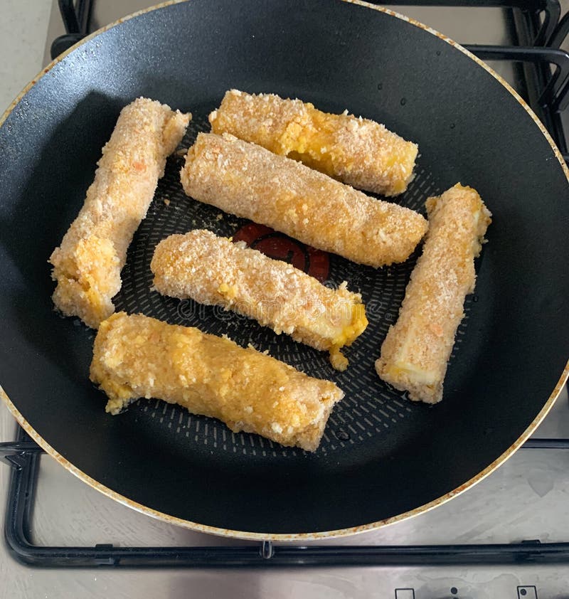 Fried Mozzarella Cheese Sticks Breaded on Frying Pan Stock Photo ...