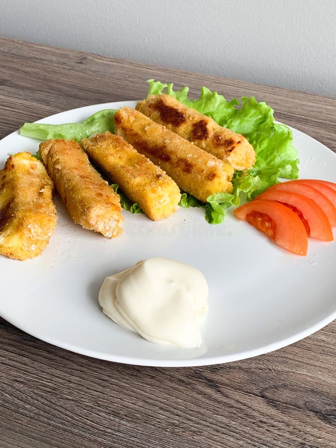 Fried Mozzarella Cheese Sticks Breaded on White Plate Stock Photo ...