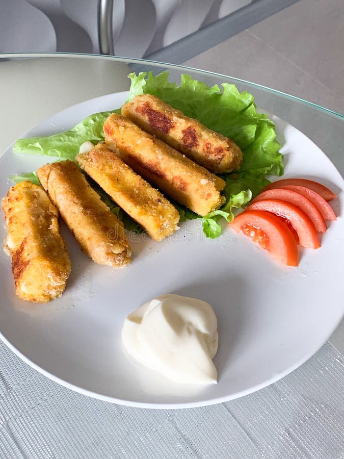 Fried Mozzarella Cheese Sticks Breaded on White Plate Stock Photo ...