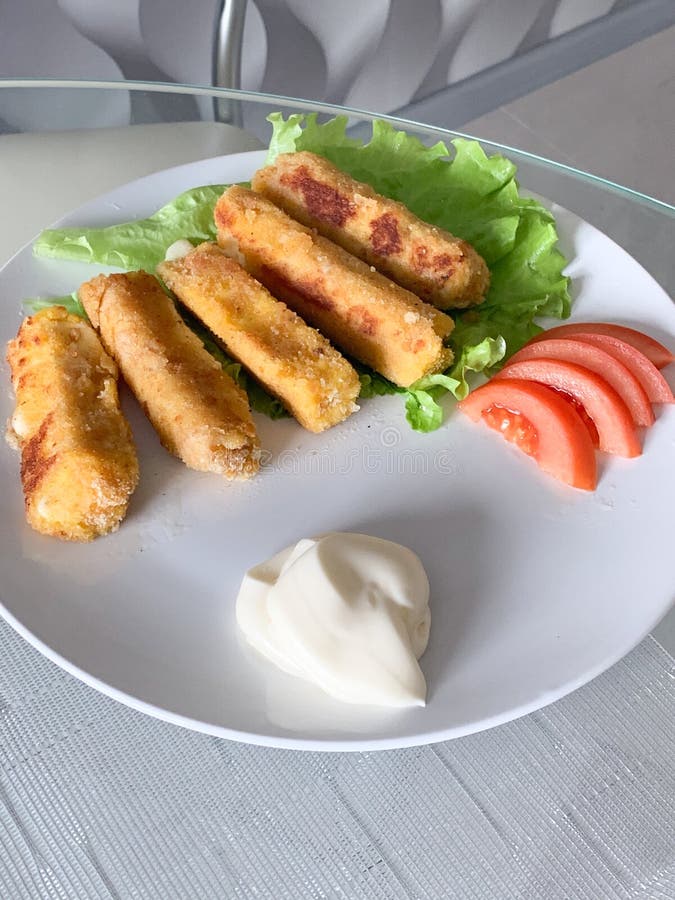 Fried Mozzarella Cheese Sticks Breaded on White Plate Stock Image ...
