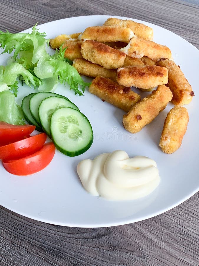 Fried Mozzarella Cheese Sticks Breaded on White Plate Stock Photo ...