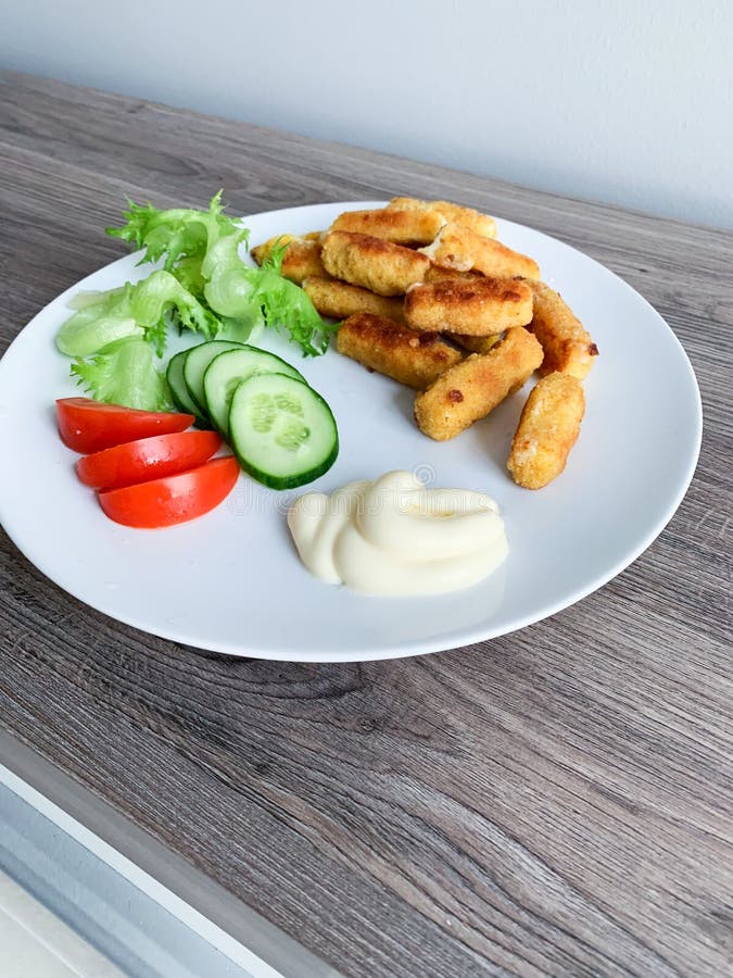 Fried Mozzarella Cheese Sticks Breaded on White Plate Stock Photo ...