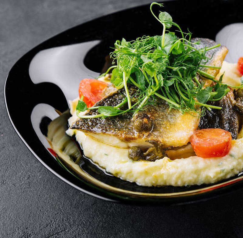 Fried Norwegian Skrei Cod Fish Filet with Mashed Potatoes Stock Photo ...