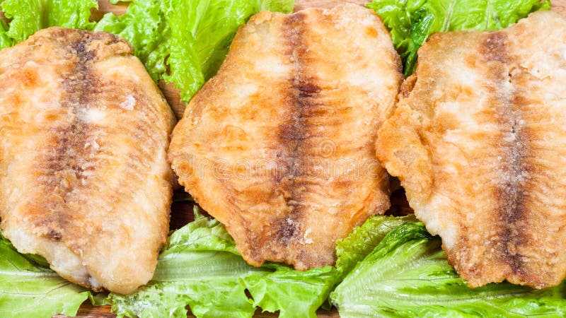 Fried Ocean Perch Fillet on Green Lettuce Stock Image - Image of dinner ...
