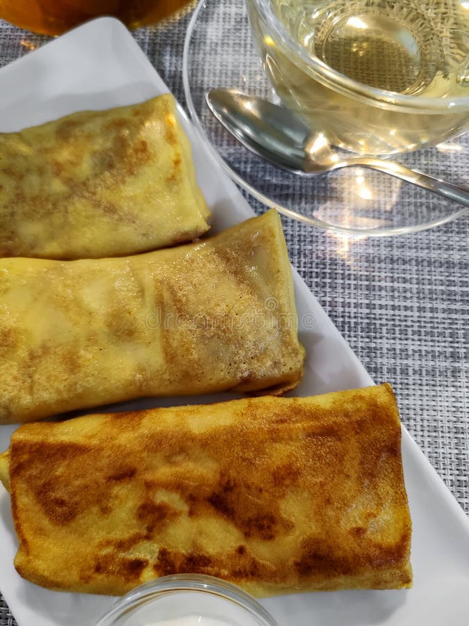 Fried Pancakes Stuffed with Meat and Sour Cream on a Rectangular White ...