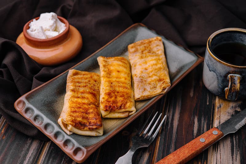 Fried Pancakes Twisted with Meat Inside on a Plate Stock Image - Image ...