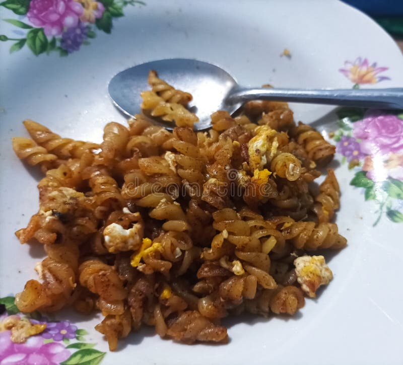 Fried pasta simple cooking stock image. Image of produce - 264743871