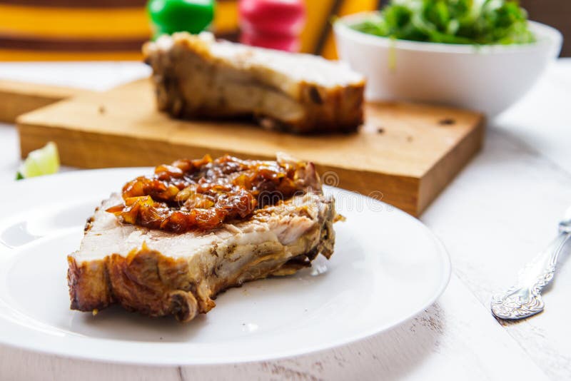 Fried Piece of Pork on a White Ceramic Plate Side View Stock Image ...